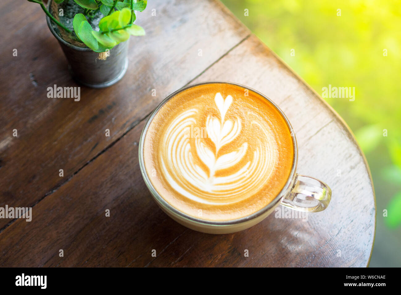 coffee latte on wood table,aerial view,sun light Stock Photo - Alamy