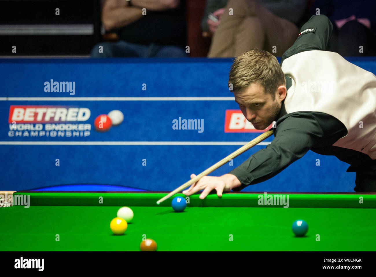 Jamie Jones of Wales plays a shot to Shaun Murphy of England in their ...