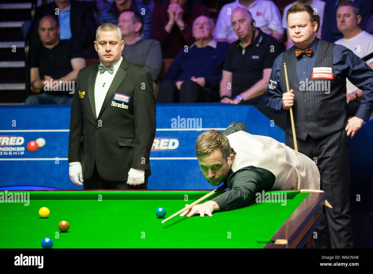 Jamie Jones of Wales plays a shot to Shaun Murphy of England in their ...