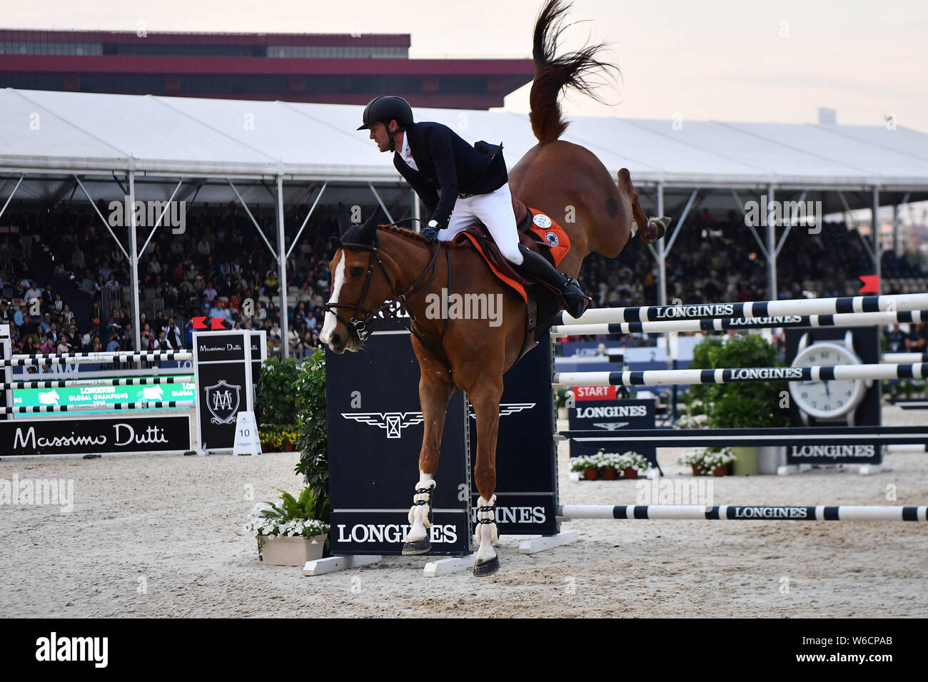 An equestrian competes in the 1.60m Longines Grand Prix Against the ...