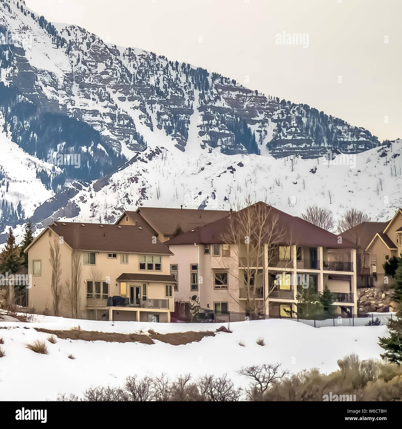 Square Neighborhood built on a hill overlooking a striking snowy ...