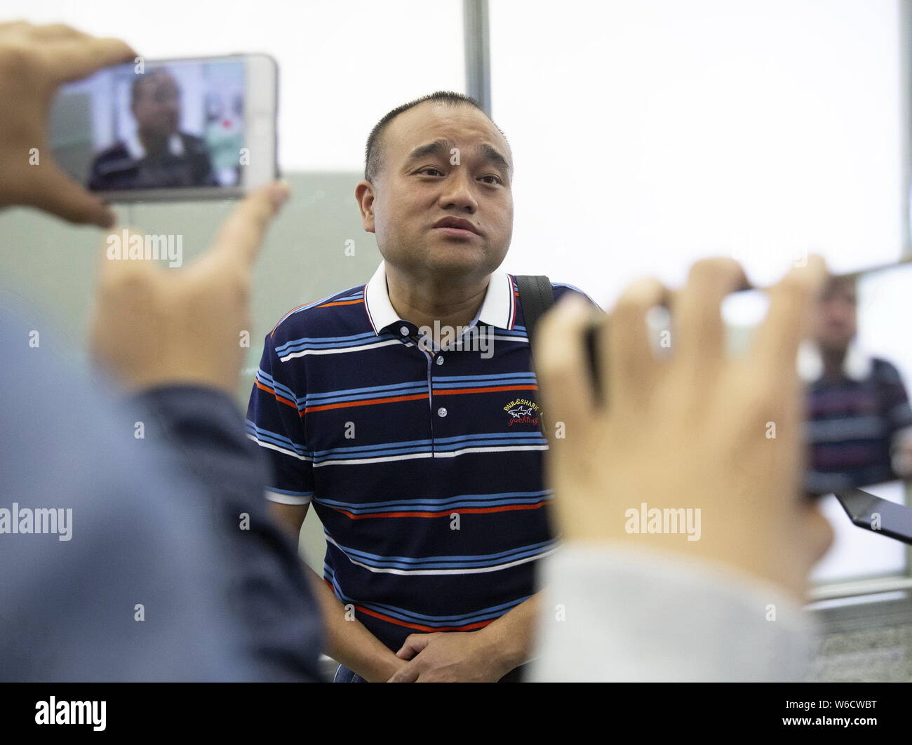 Chinese doctor Tan Qindong who was detained for three months for ...