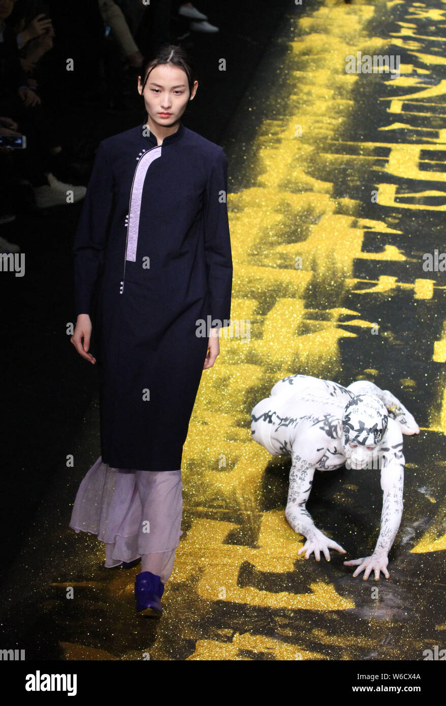 A Model Displays A New Creation At The Fashion Show Of A Life On The Left By Lin Qi During The