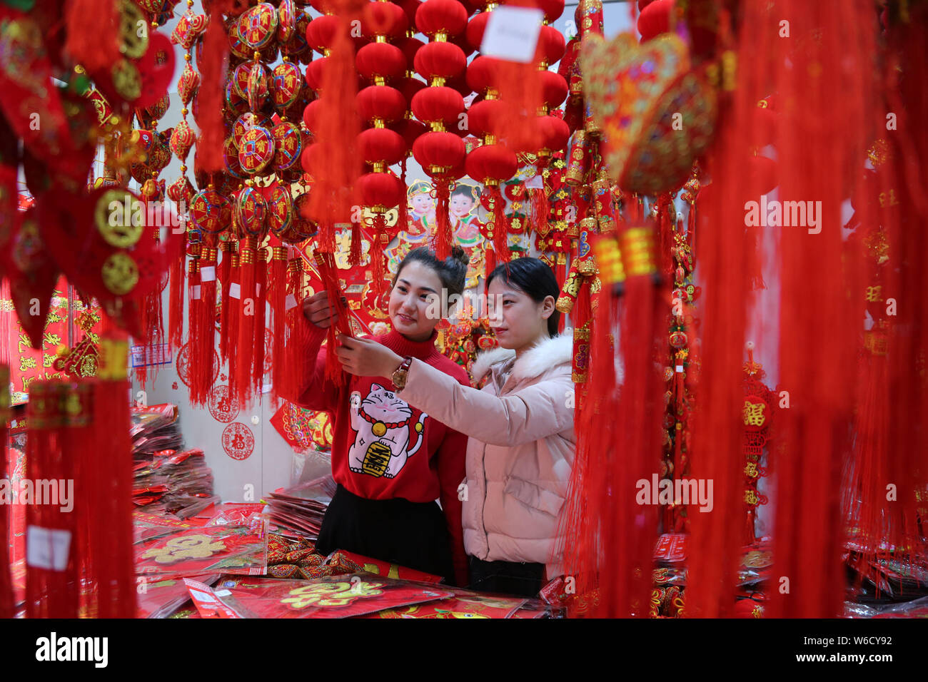 --FILE--Local residents shop for red lanterns, decals and other ...