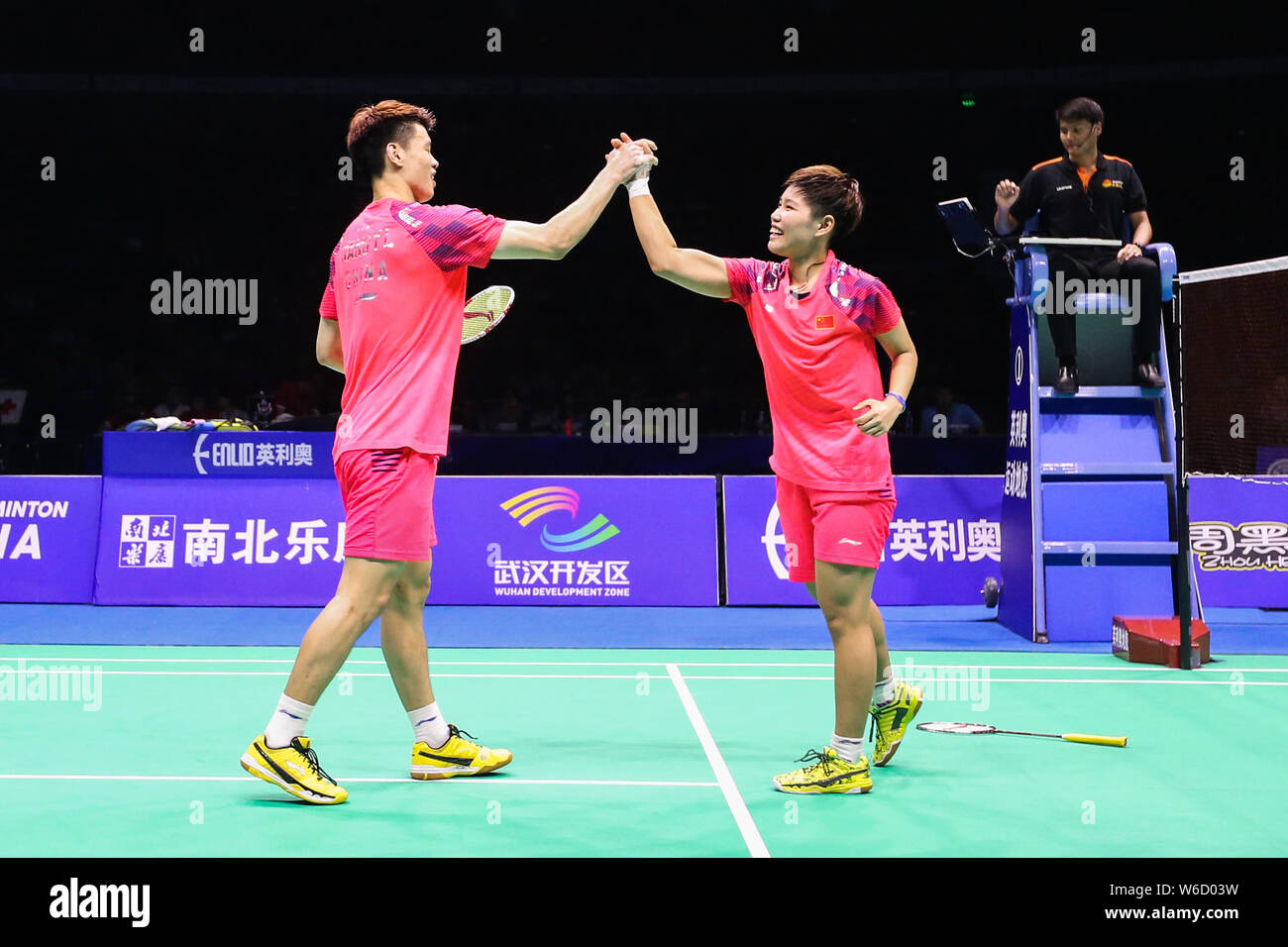 Wang Yilyu, left, of China and Huang Dongping celebrate after defeating ...