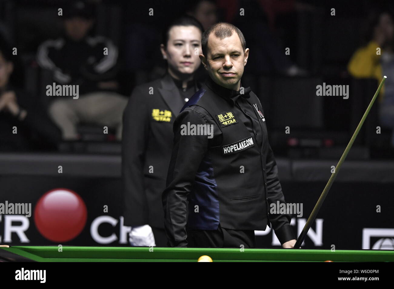 Barry Hawkins of England considers a shot to Mark Selby of England in ...