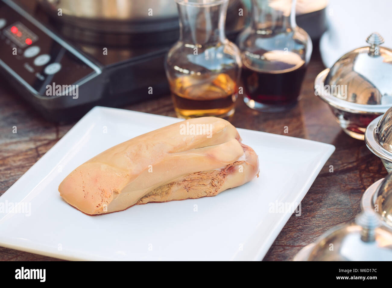 Goose liver on a wooden Board in the restaurant before cooking Stock ...