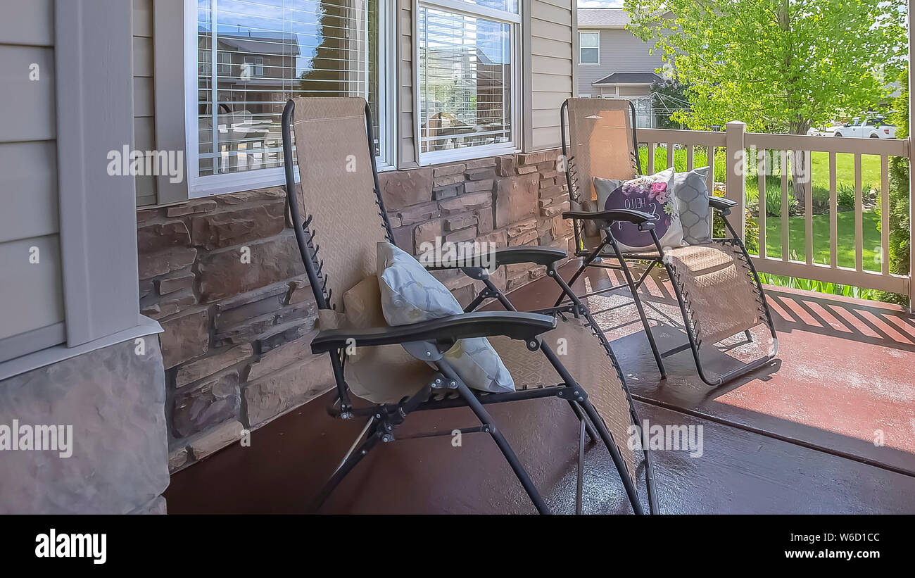 Panorama frame Relaxing seats on the porch of a home with view of the ...