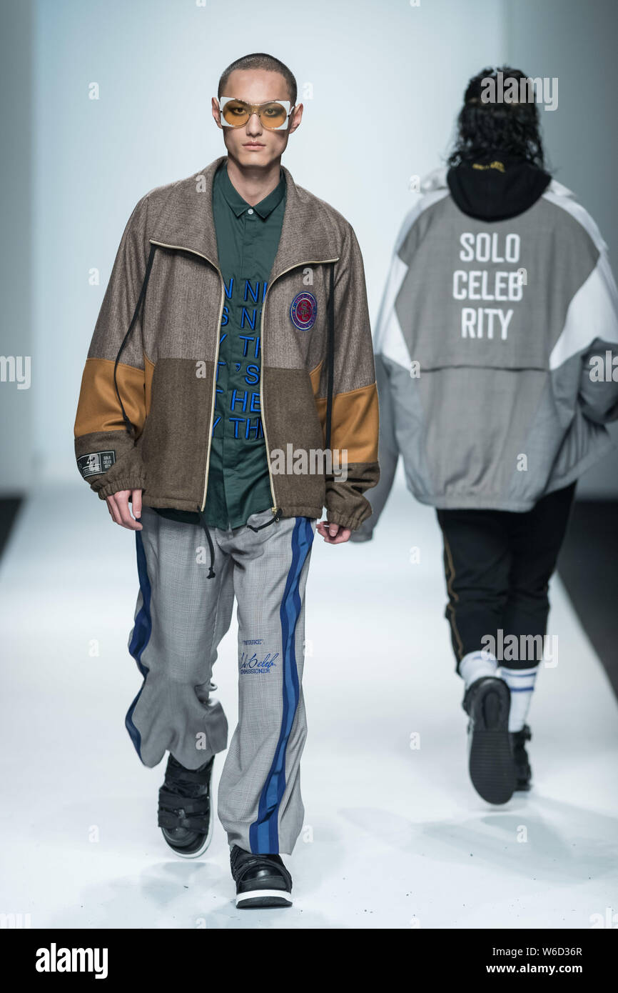 A model displays a new creation at the fashion show of SOLO CELEB ...