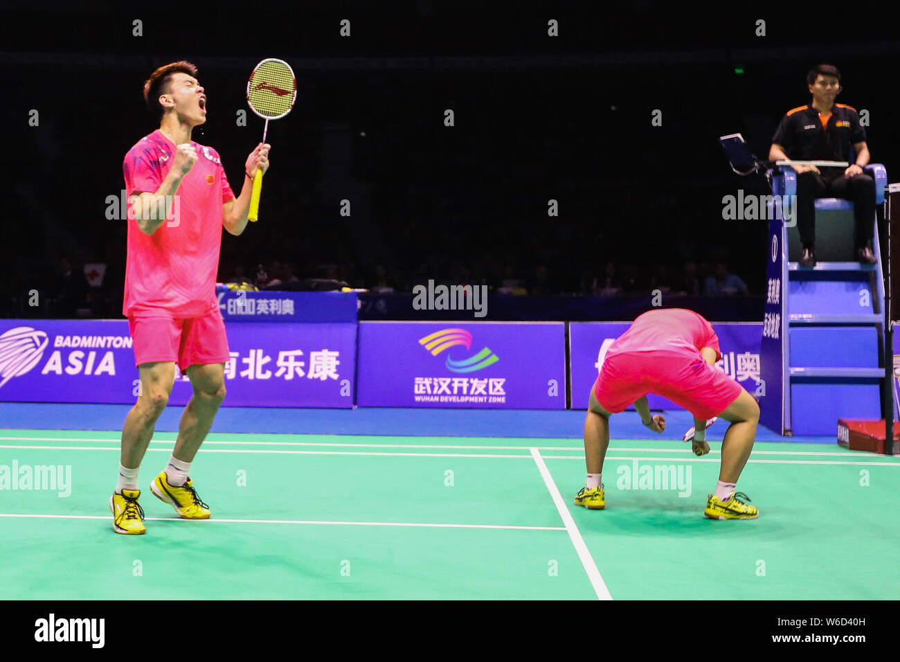 Wang Yilyu, left, of China and Huang Dongping celebrate after defeating ...