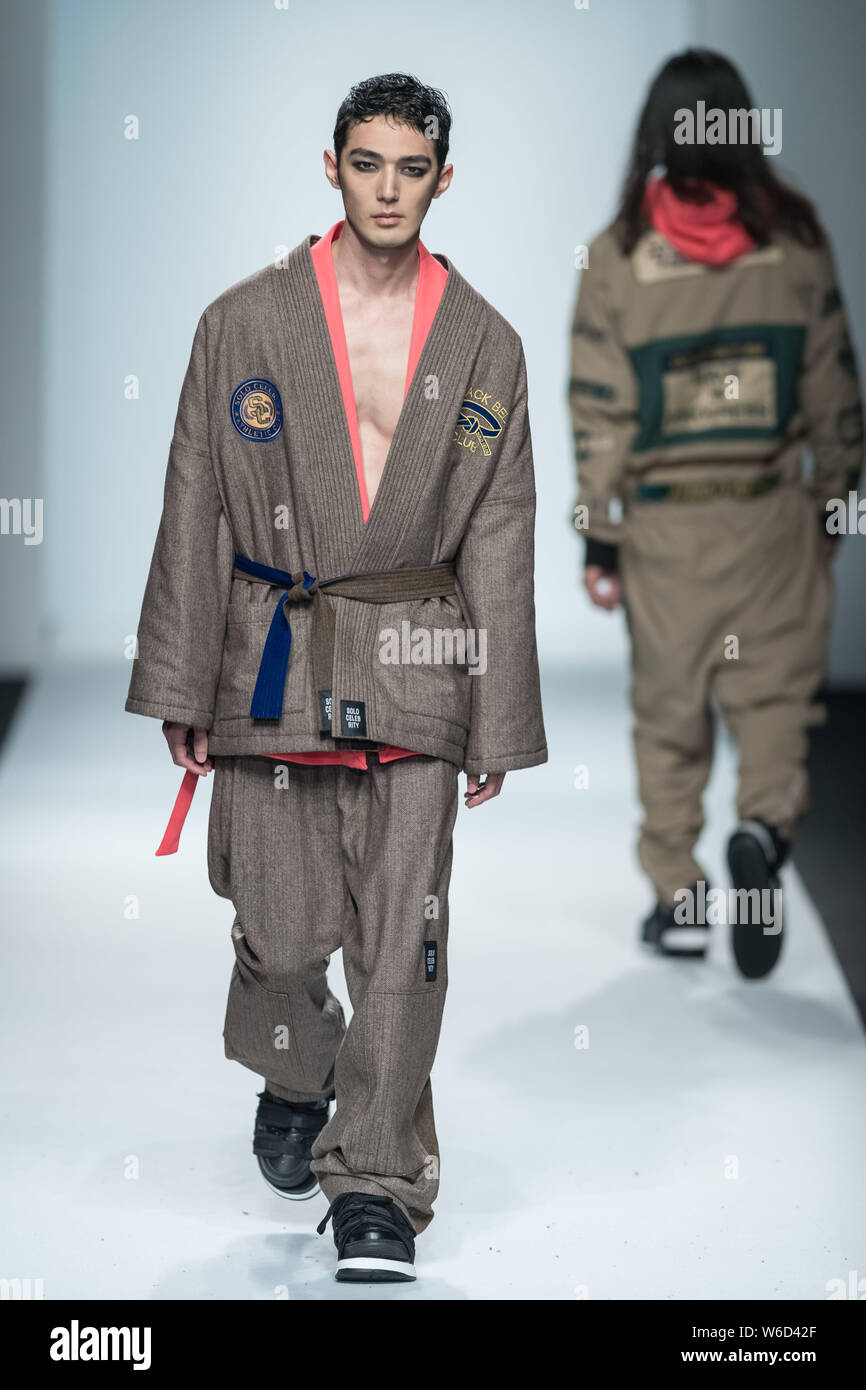 A model displays a new creation at the fashion show of SOLO CELEB ...