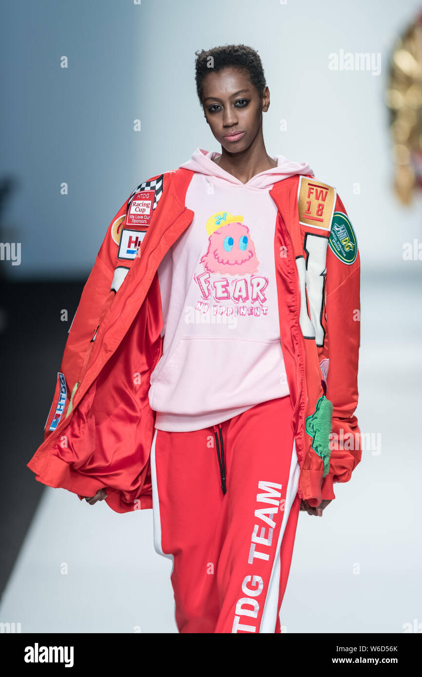 A model displays a new creation at the fashion show of SOLO CELEB ...