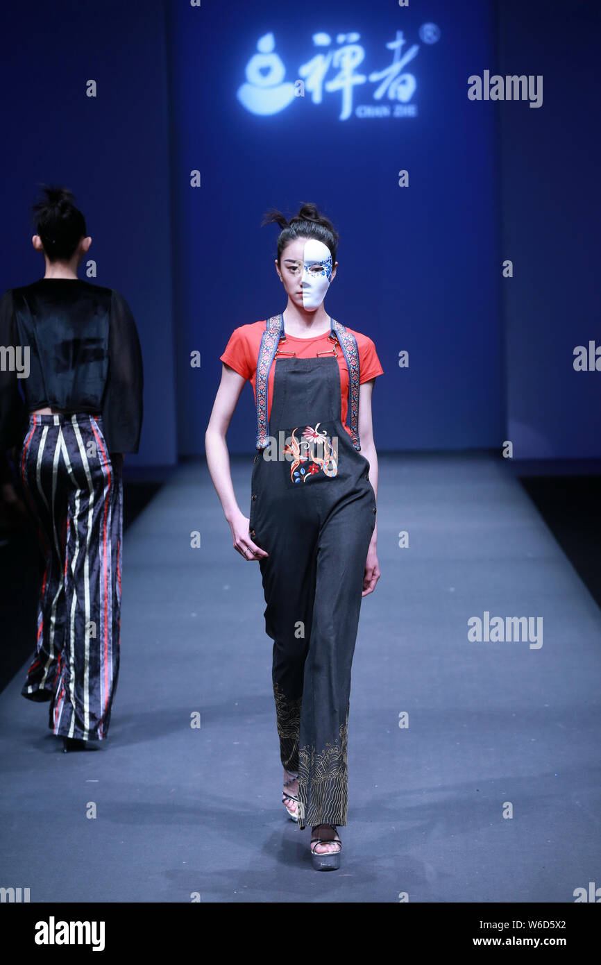 A model displays a new creation at the fashion show of Chan Zhe by Zhao ...