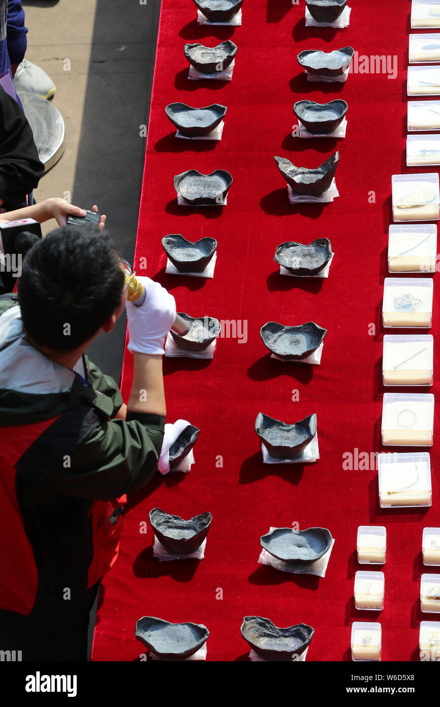 Silver ingots unearthed from the sunken boats owned by peasant leader ...