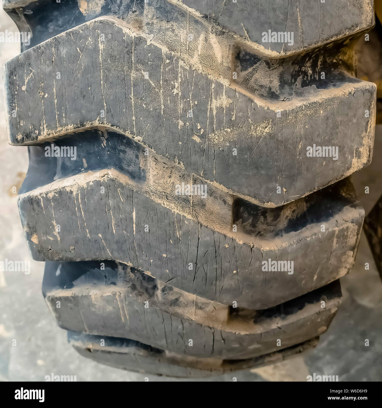 Square Details of the thick and heavy duty wheel of a yellow ...