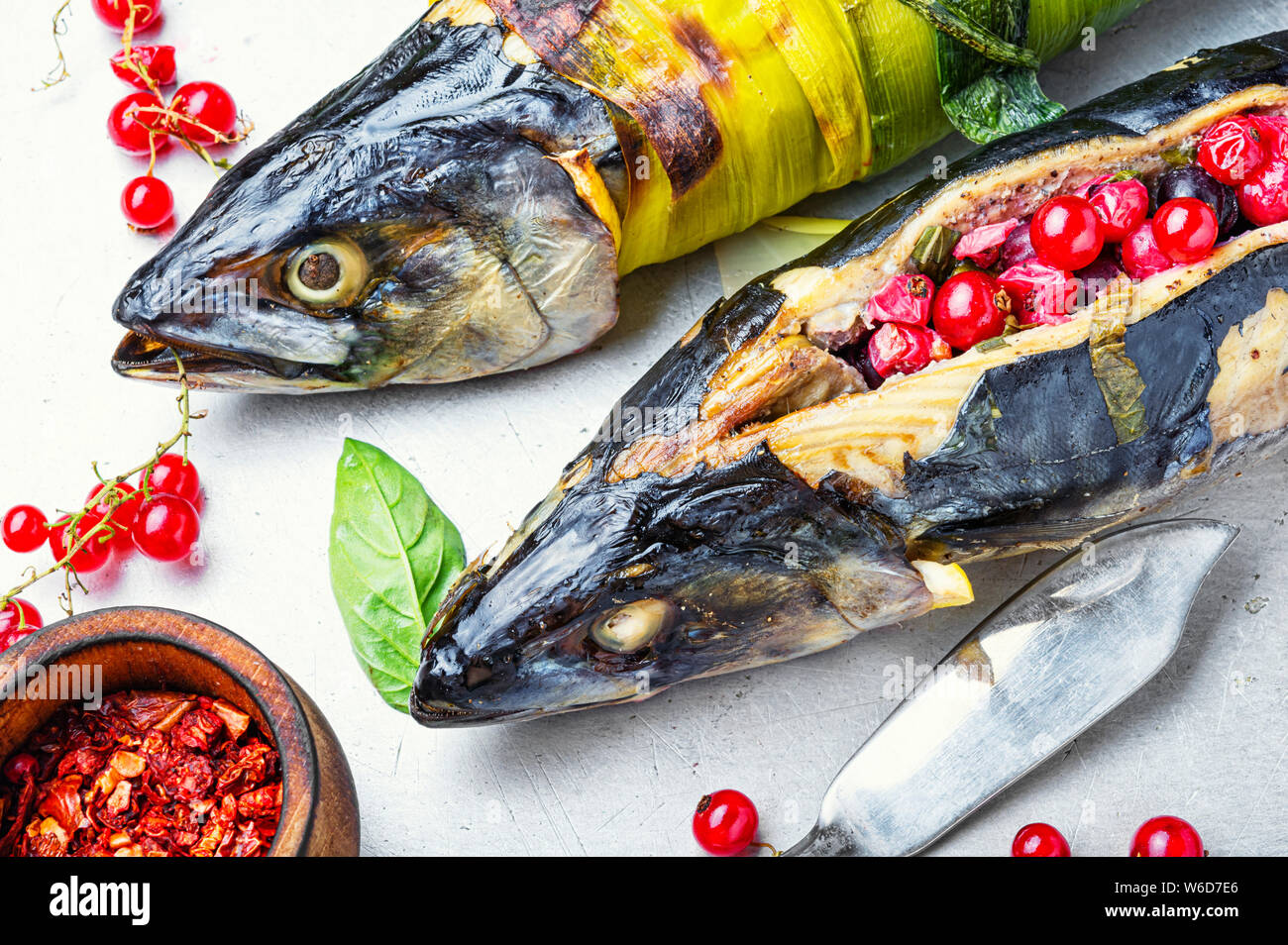 Baked mackerel stuffed with berries.Fish with currant filling.Seafood ...