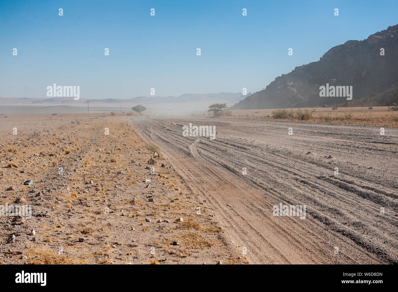 Impression of a gravel road running through Central Namibia Stock Photo ...