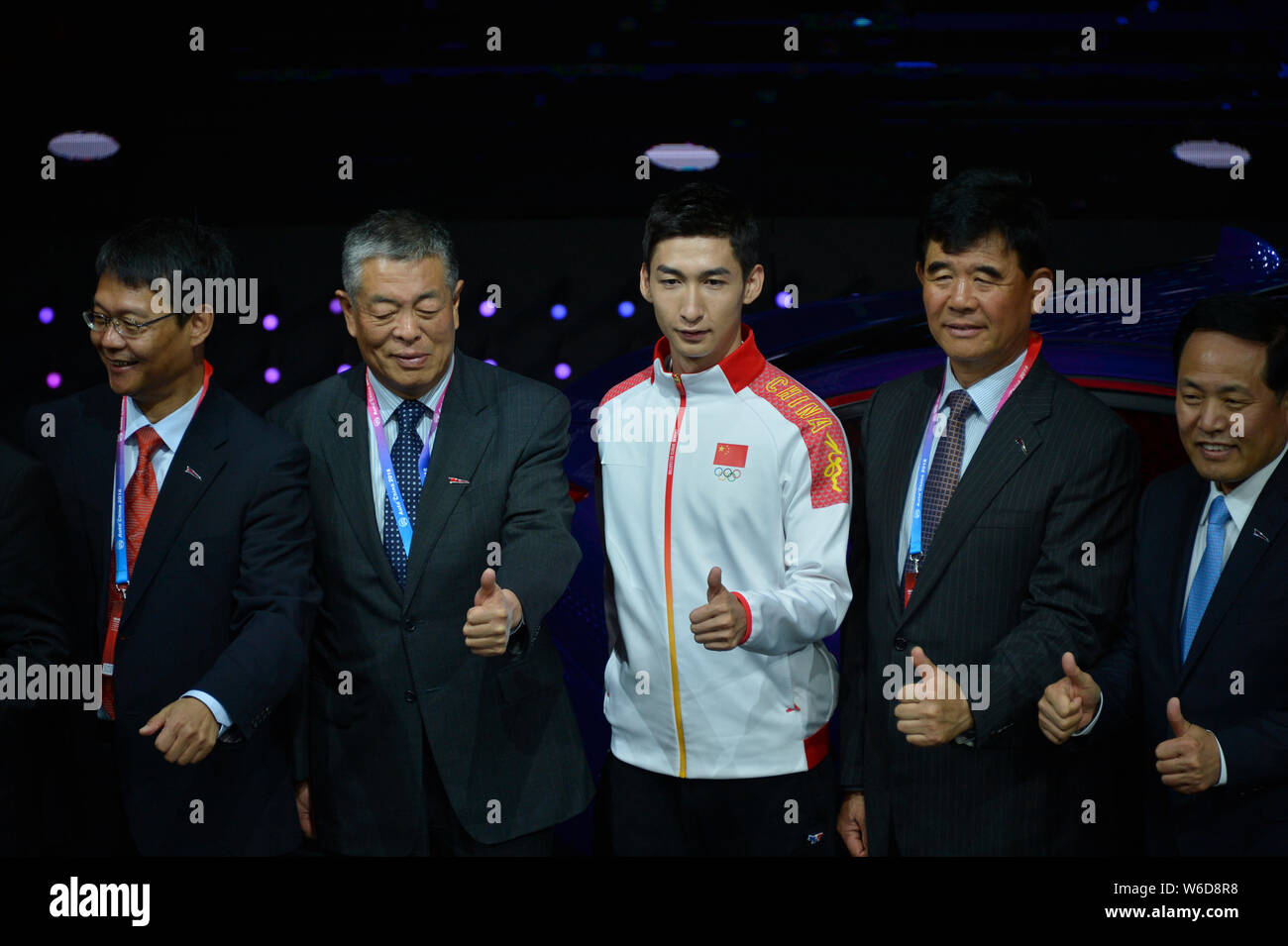 Chinese short track speed skater Wu Dajing, center, the winner of the ...