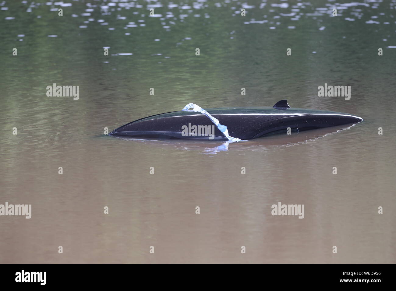 The roof of a submerged car on the A555 near Handforth, Cheshire, where ...