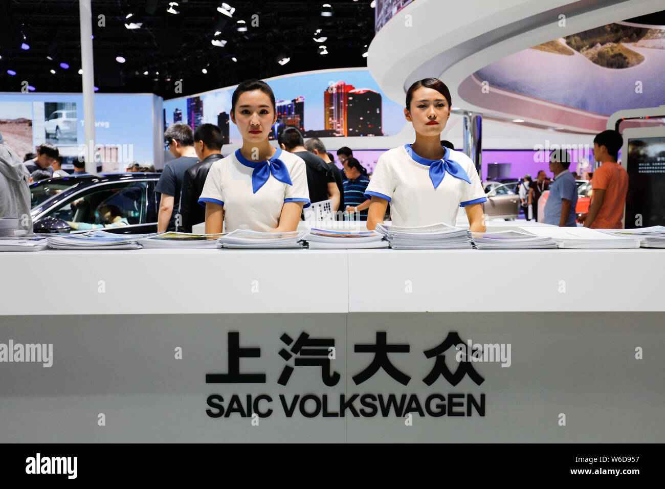 --FILE--Employees are pictured at the stand of SAIC Volkswagen, a joint ...