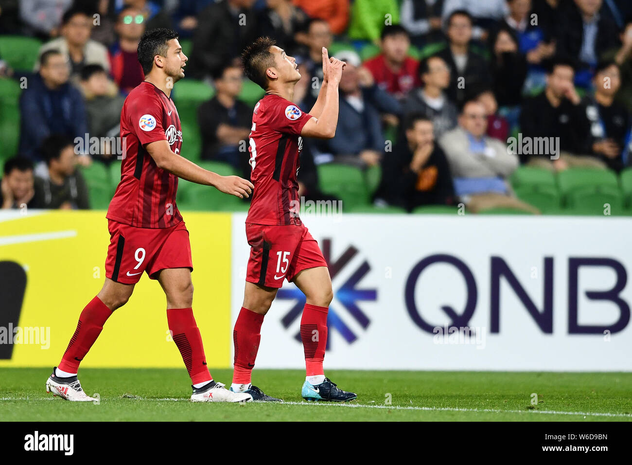 Brazilian football player Elkeson, left, and Lin Chuangyi of China's ...