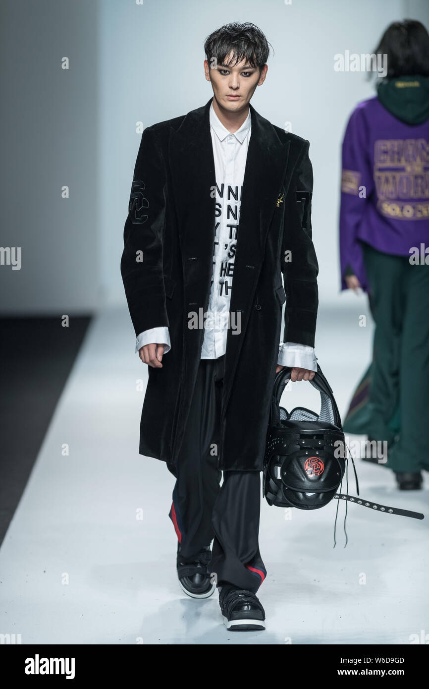 A model displays a new creation at the fashion show of SOLO CELEB ...