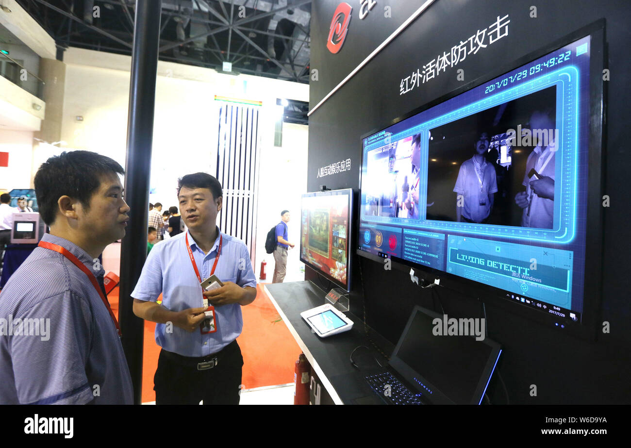 --FILE--Visitors experience the facial recognition at the stand of ...