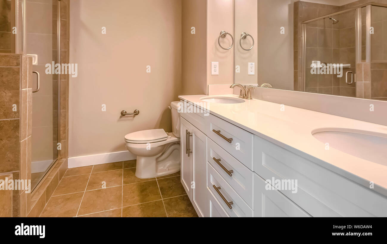 Panorama frame Vanity with double sink adjacent to the toilet inside a ...