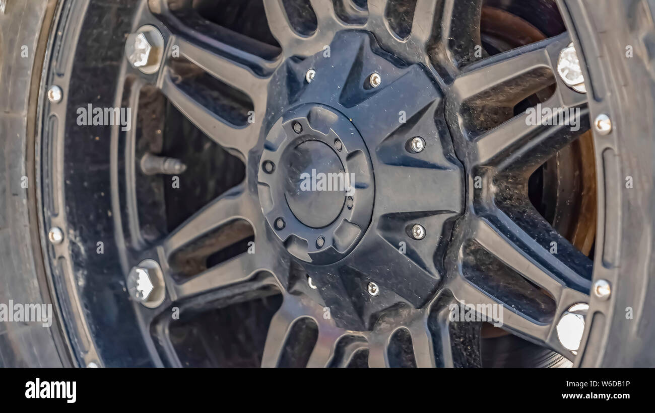 Panorama frame Close up view of the black rubber wheel of a vehicle ...