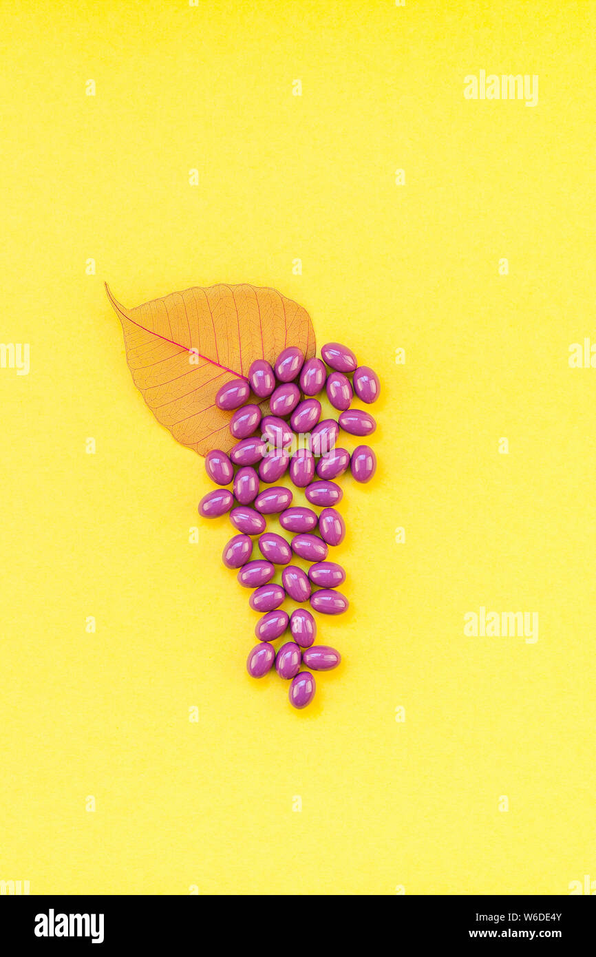 Purple nutritional supplement Grape seed extract pills in bunch of ...