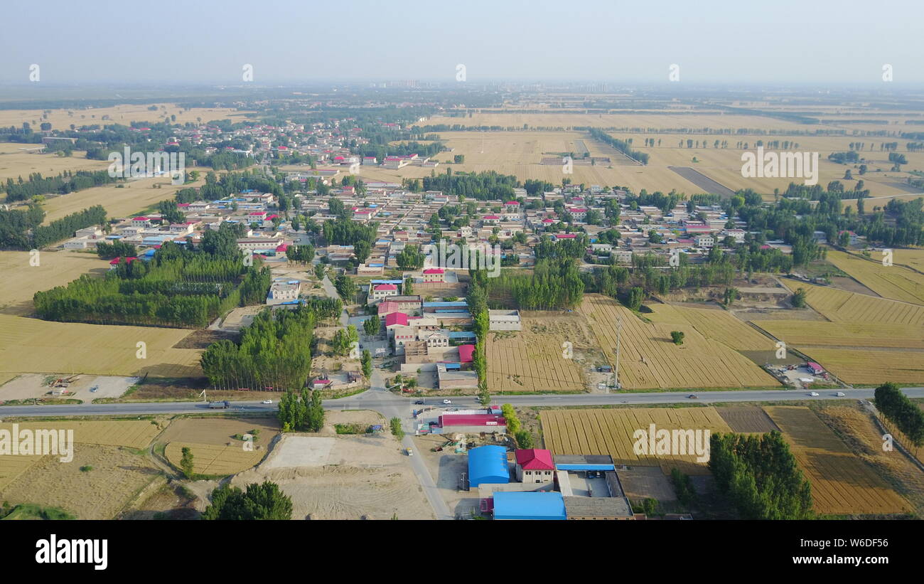 --FILE--An aerial view of houses at Dawang town in Anxin county, one ...