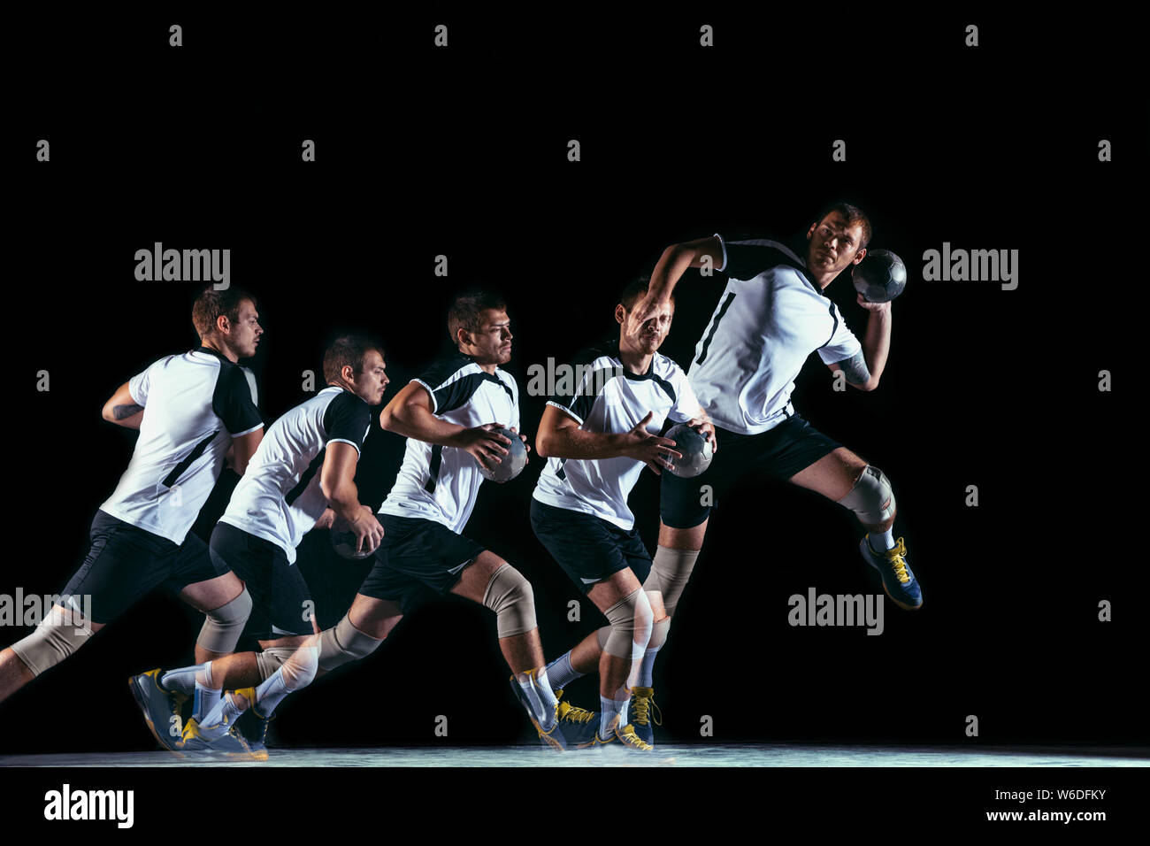 Caucasian young handball player in action and motion in mixed and ...
