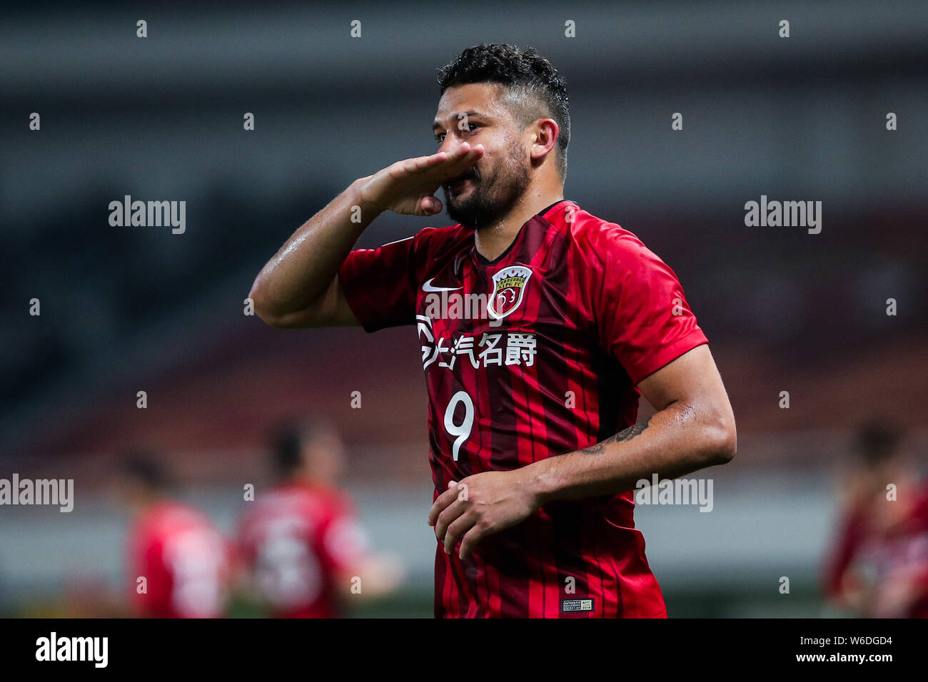 Brazilian football player Elkeson of China's Shanghai SIPG FC poses to ...
