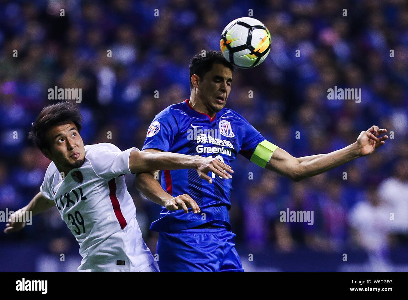 Colombian football player Giovanni Moreno, right, of China's Shanghai ...