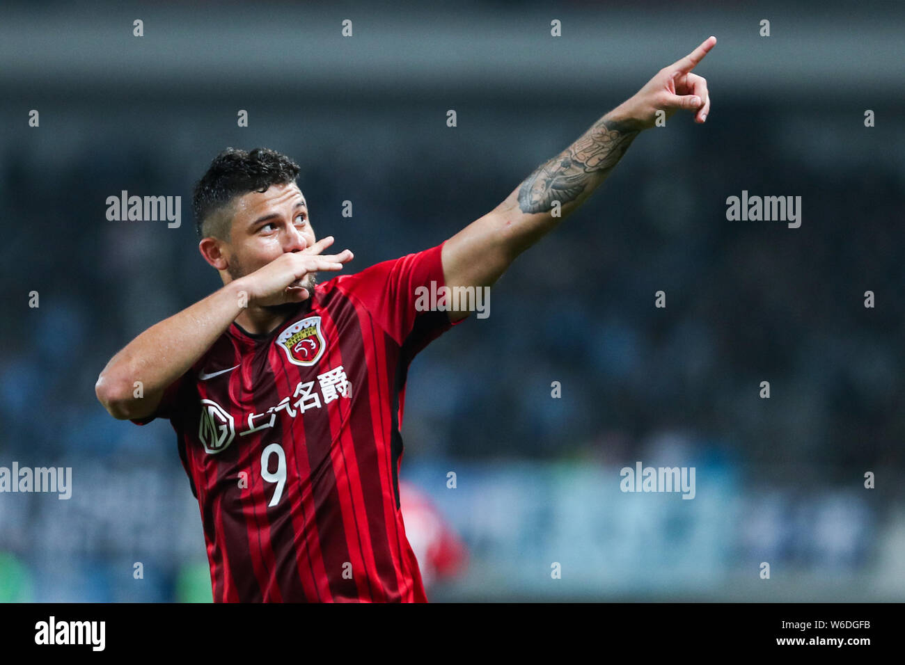 Brazilian football player Elkeson of China's Shanghai SIPG FC poses to ...