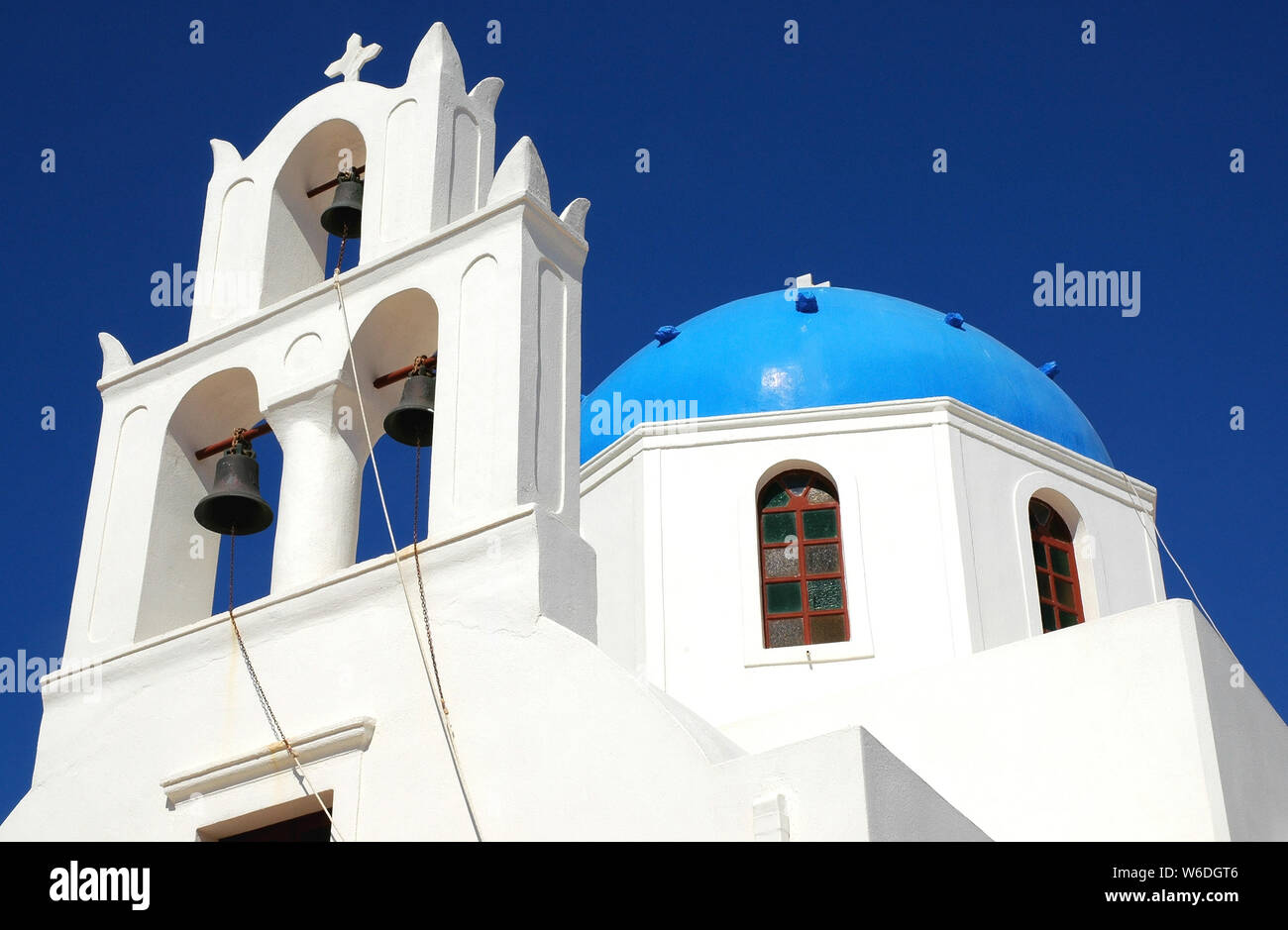 A blue domed church in Santorini, Greece. Santorini is famous for blue ...