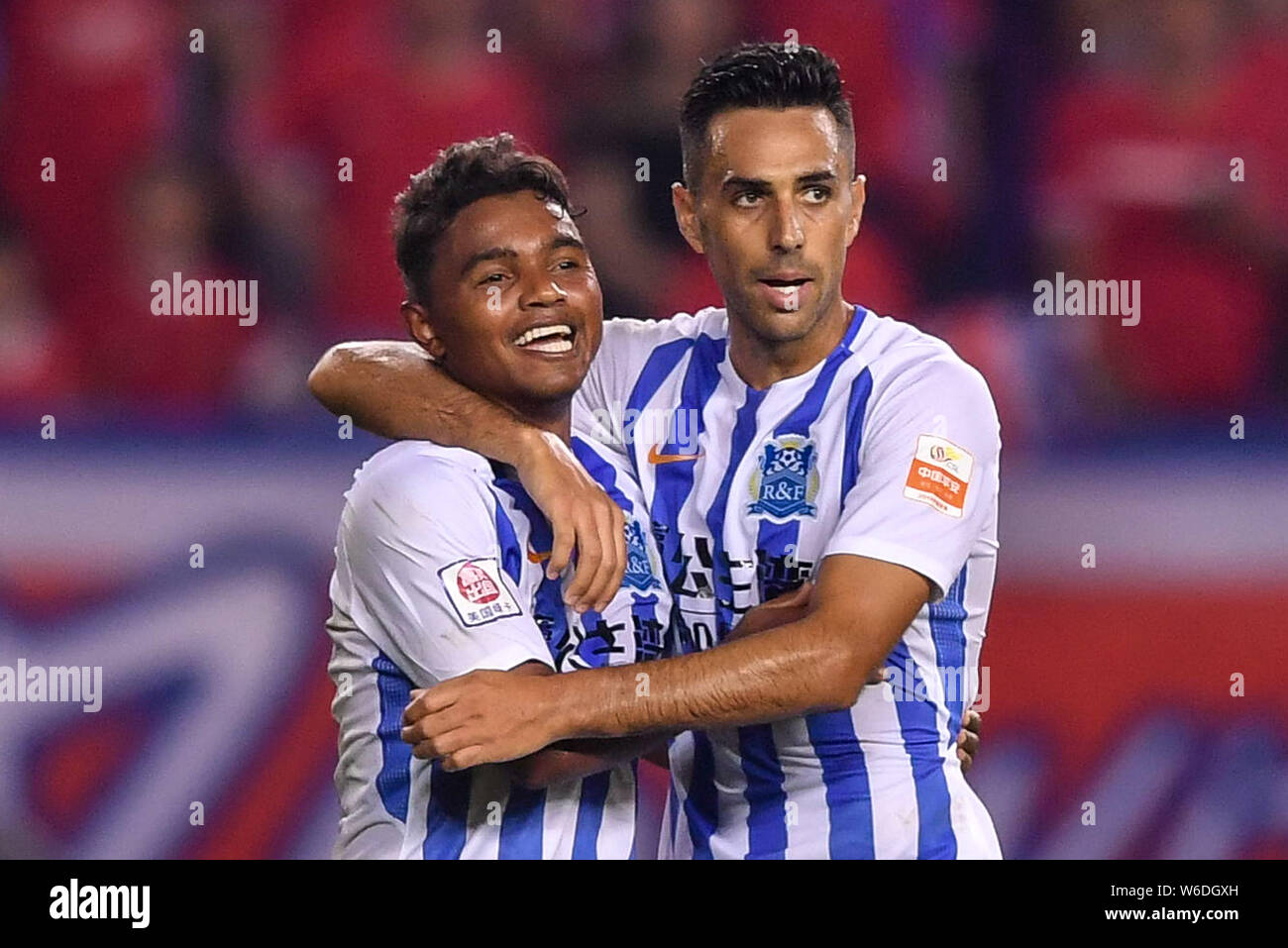Israeli football player Eran Zahavi, right, and Brazilian football ...