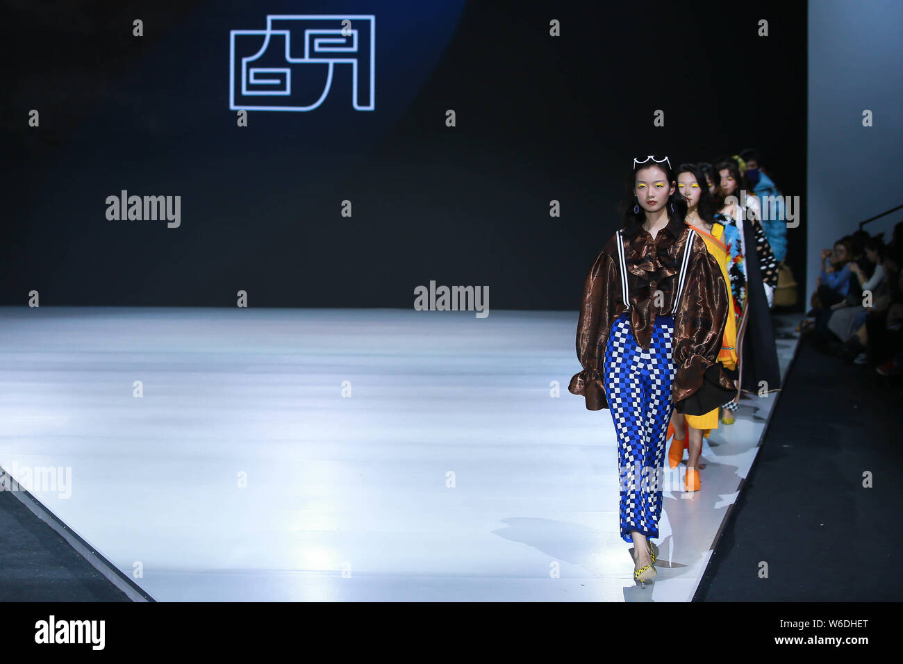 Models display creations of knitwears by graduates during a fashion ...