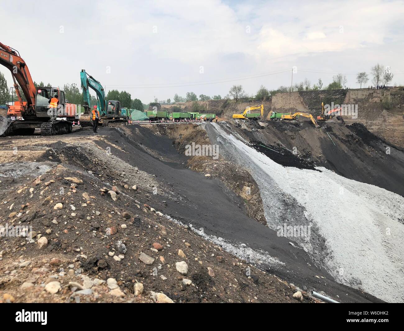 Excavators clear illegal chemical waste dumping by the Shanxi Sanwei ...