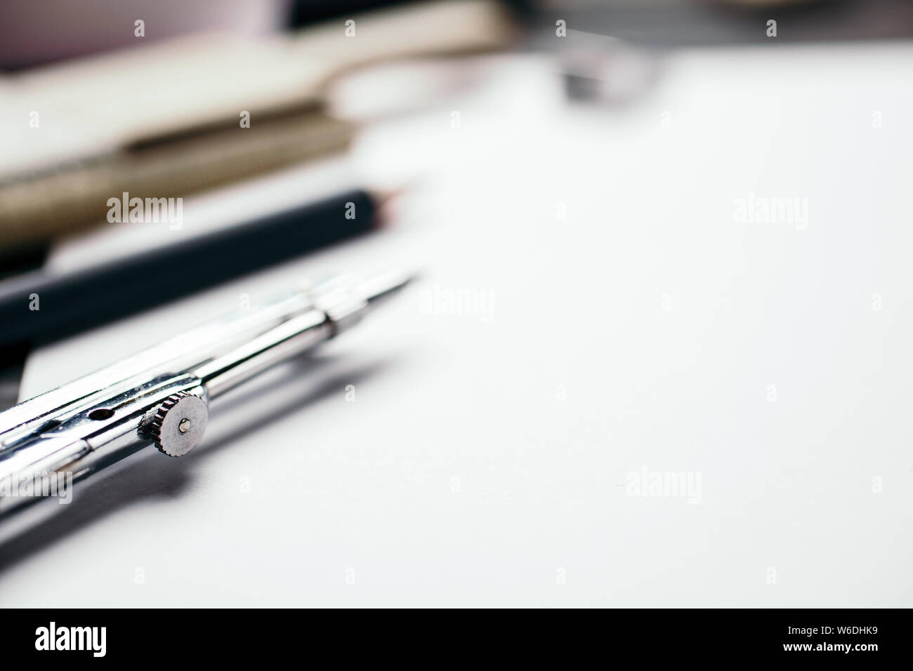 Compasses and Architect scale ruler placed on the desk Stock Photo - Alamy