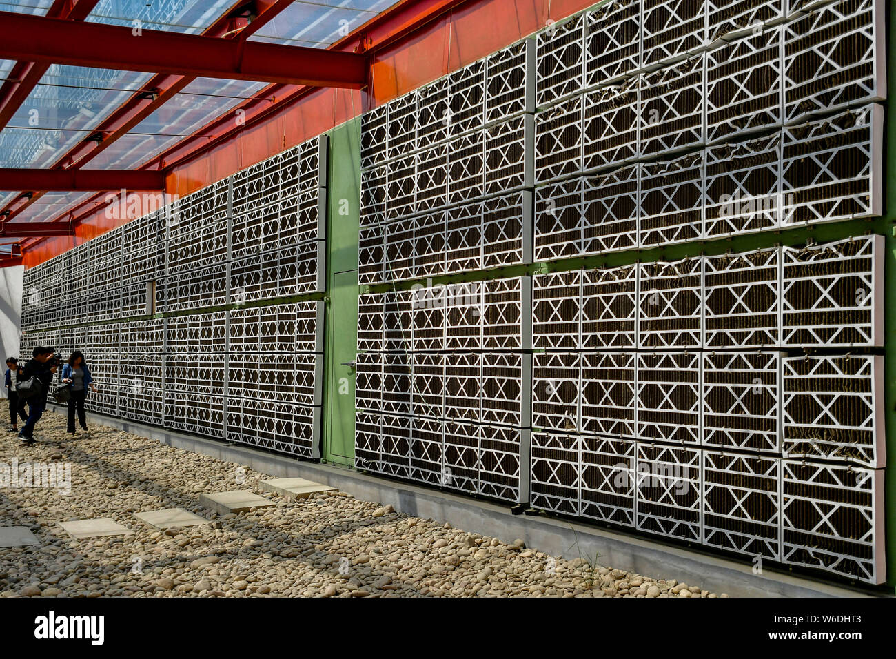 People visit the interior of a 60-meter-tall air purification tower ...