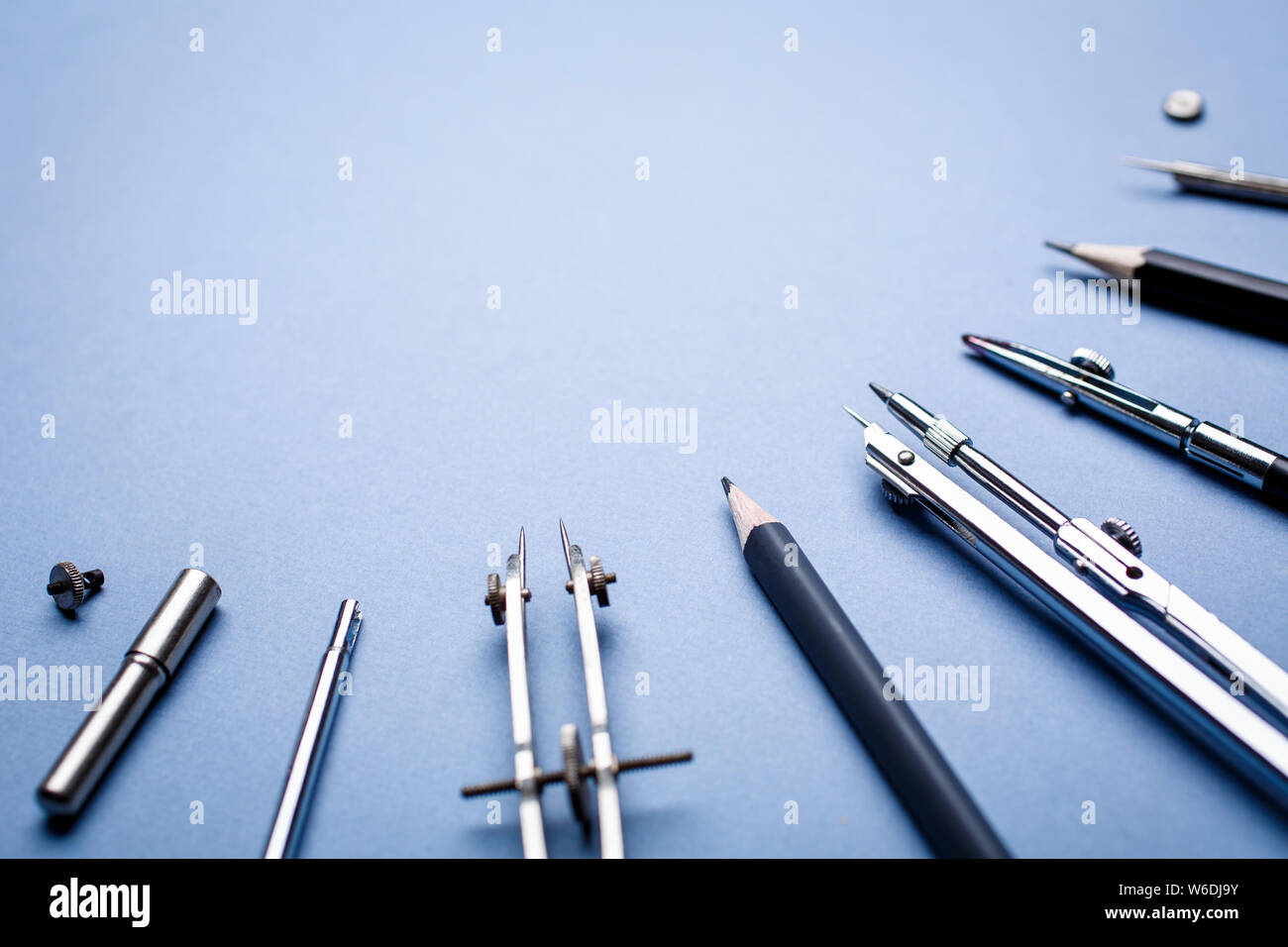 Tools for drawing blueprints laid out in a semicircle on a blue ...