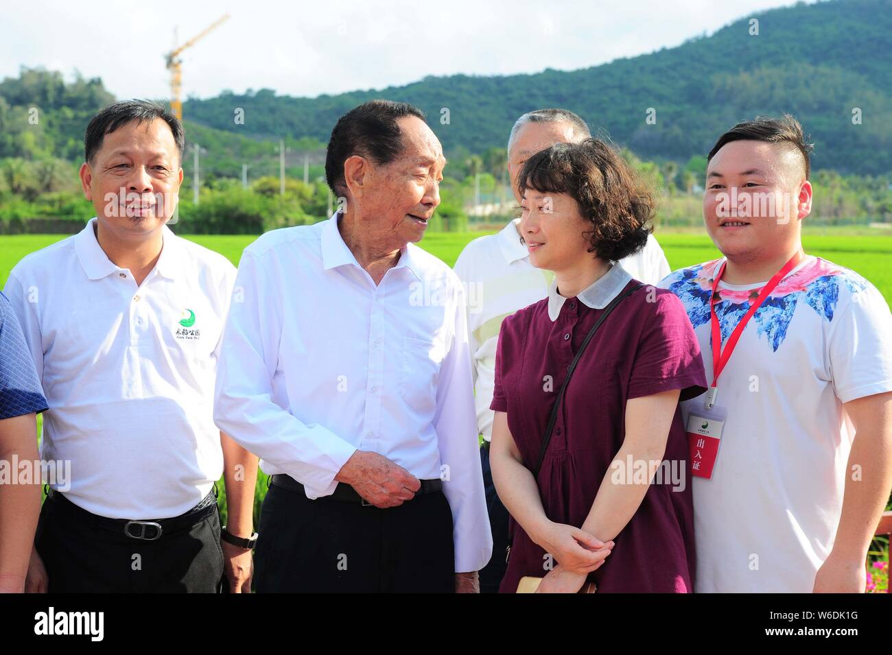 Chinese agricultural scientist and educator Yuan Longping, second left ...