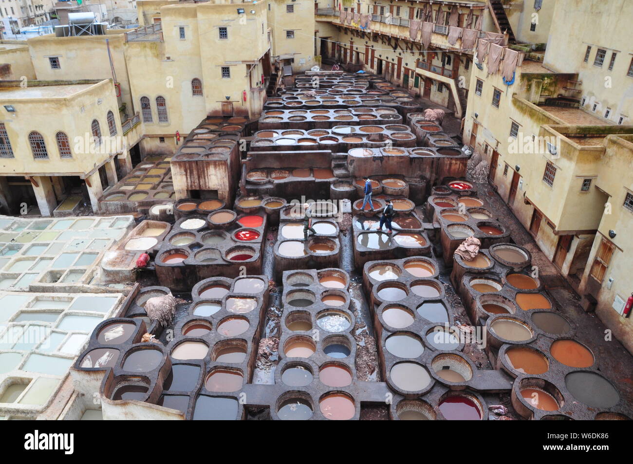 --FILE--Workers soak leather in the pools of honeycomb vats containing ...