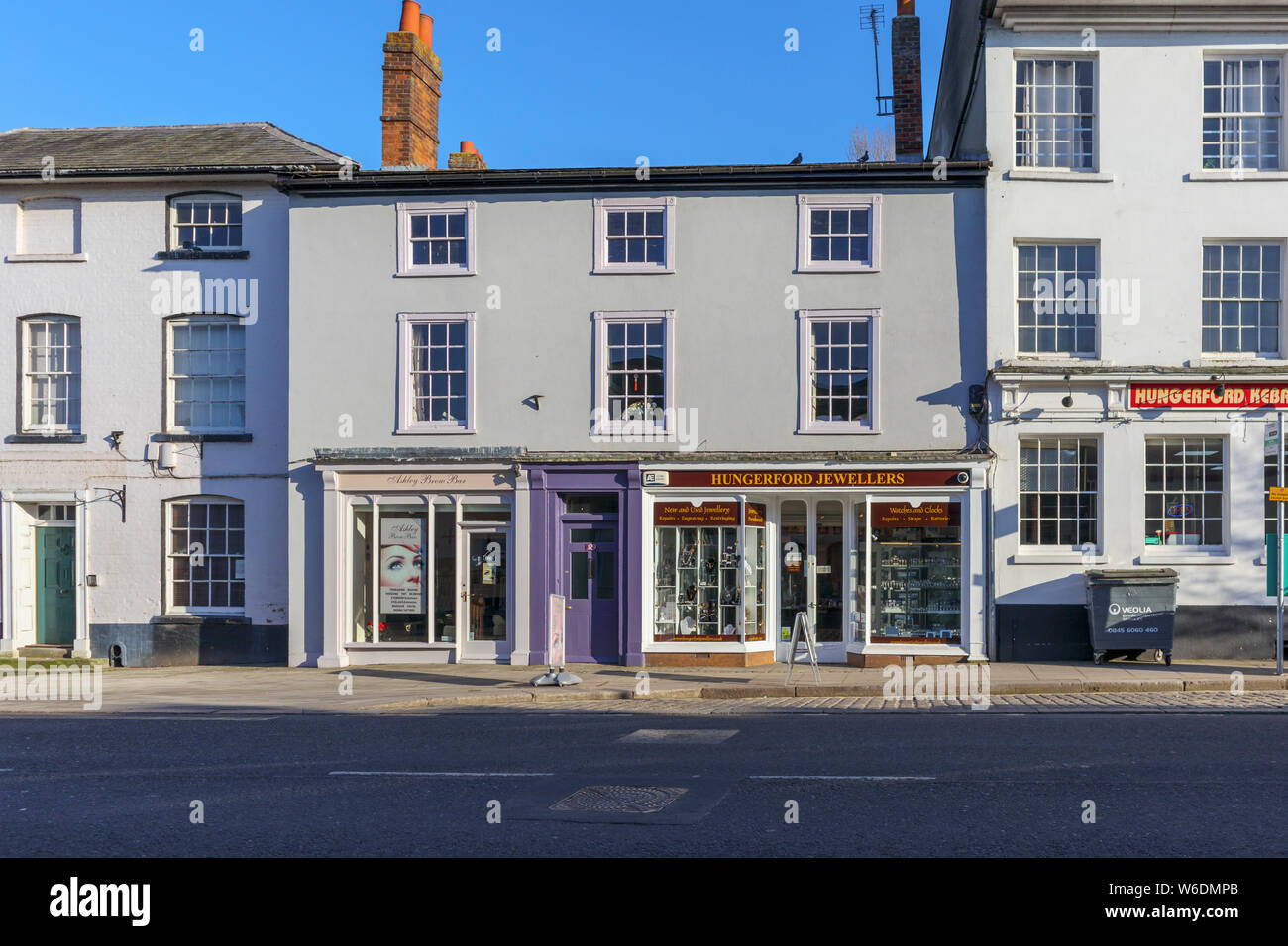 Small local roadside shops in Hungerford, a historic market town in ...