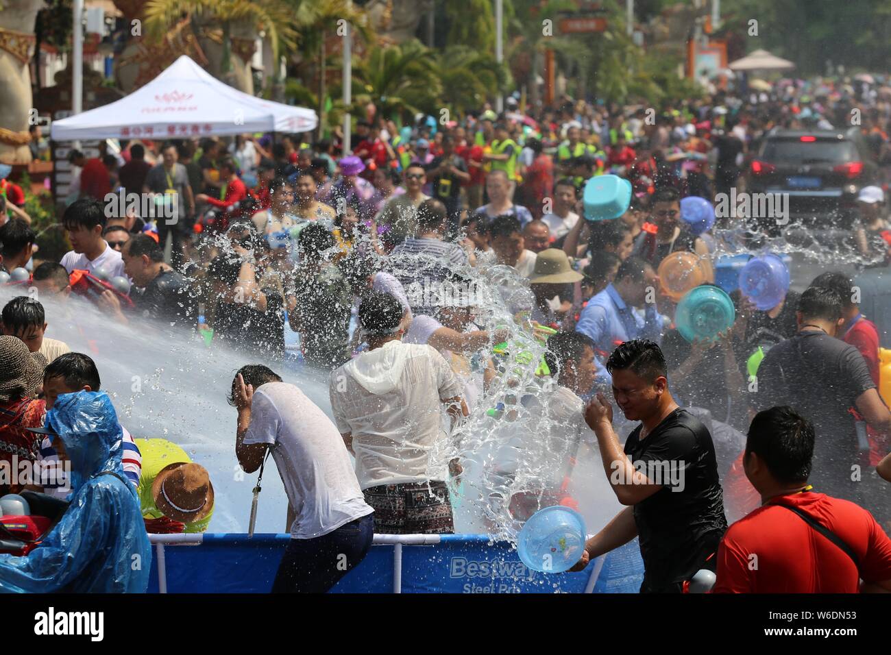 Local people and tourists sprinkle water to celebrate the Water ...