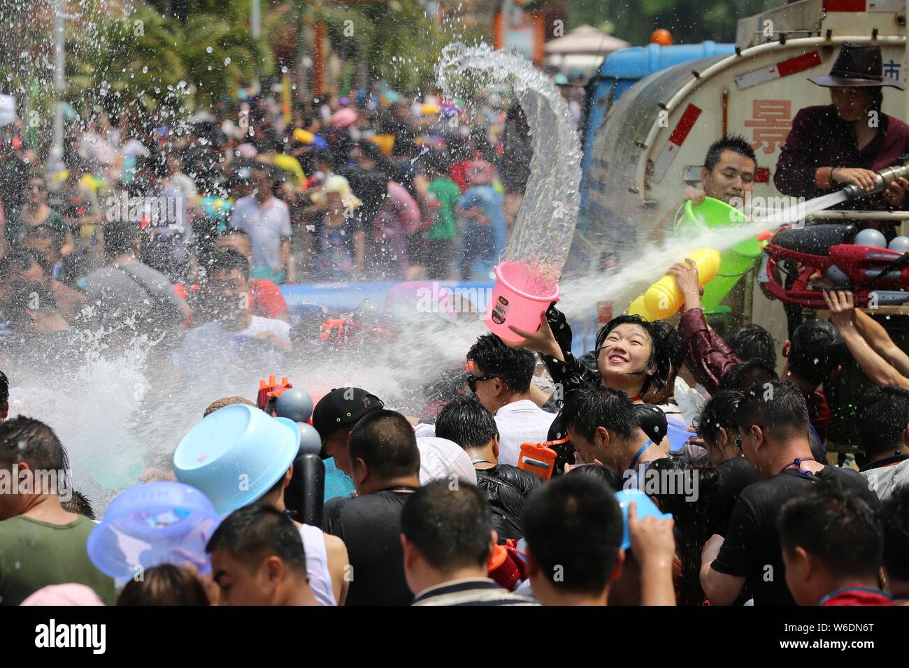 Local people and tourists sprinkle water to celebrate the Water ...