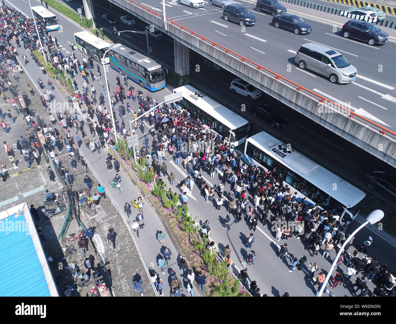 Passengers flock to take their buses as they are stranded due to the ...