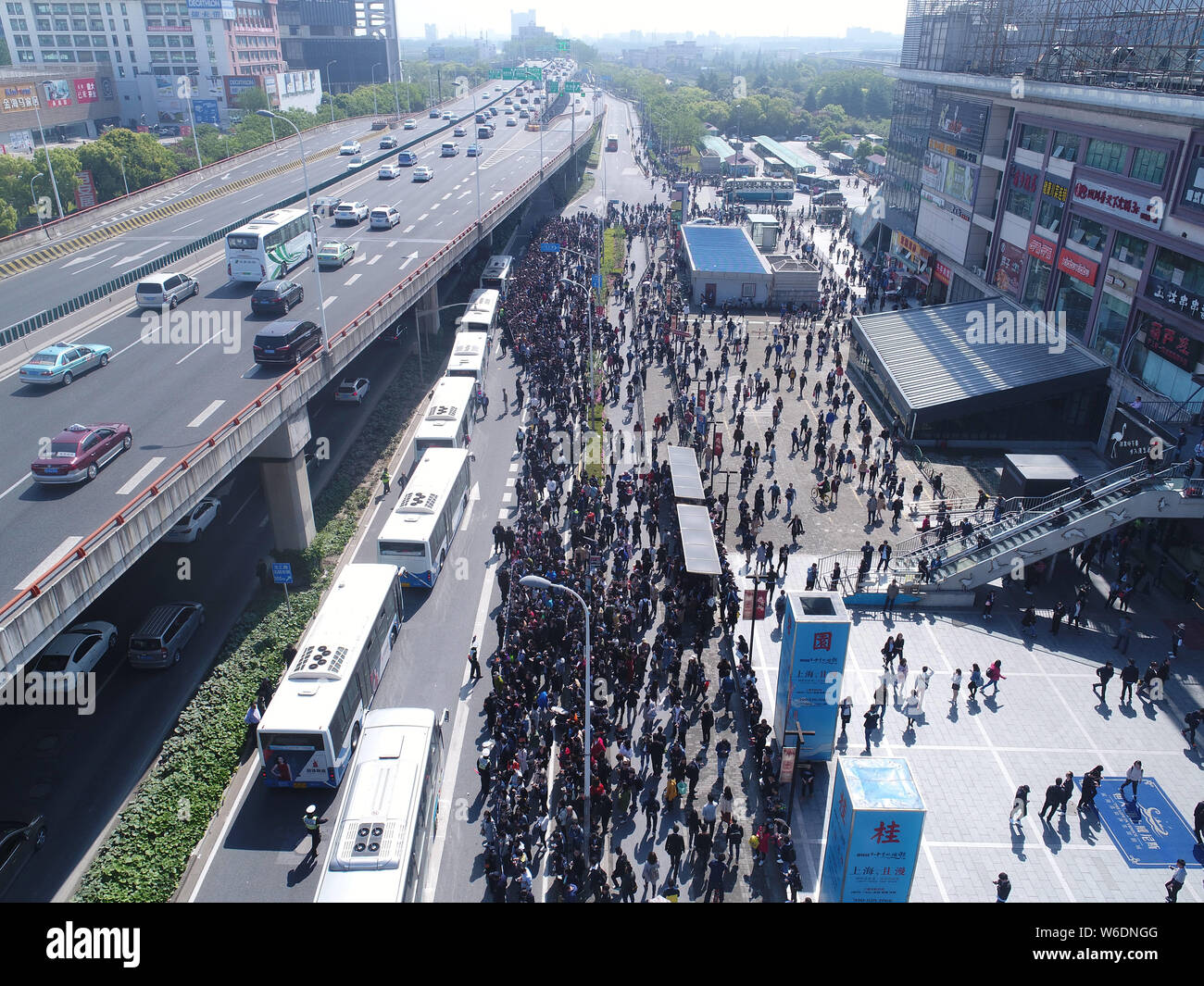 Passengers flock to take their buses as they are stranded due to the ...