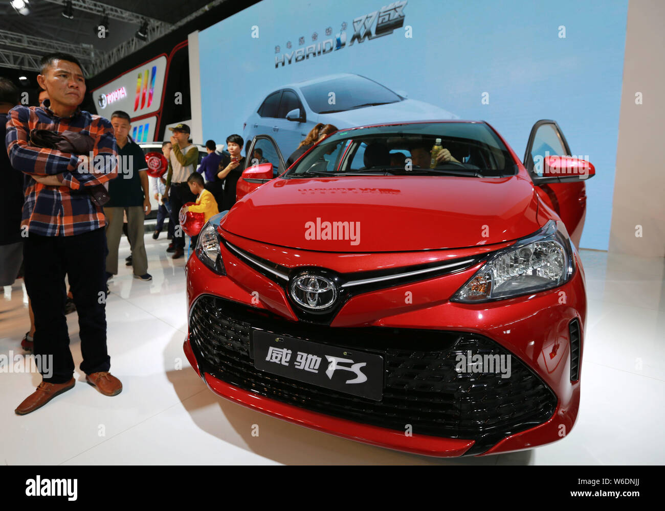 --FILE--Visitors look at a Toyota Yaris FS on display during an auto in Haikou city, south China ...